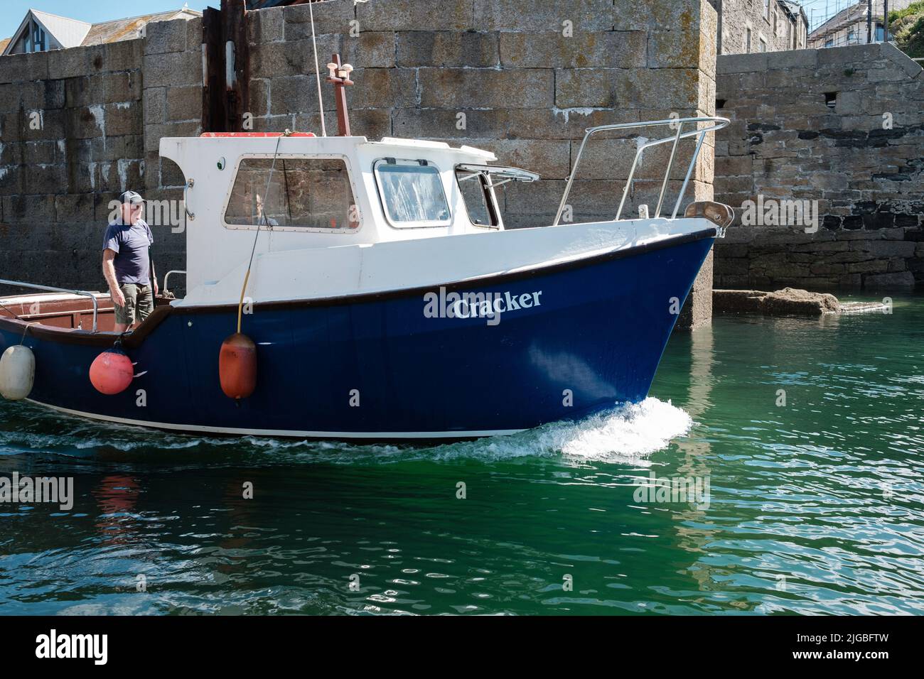 Boats leaving Porthleven Harbour, Cornwall Stock Photo - Alamy