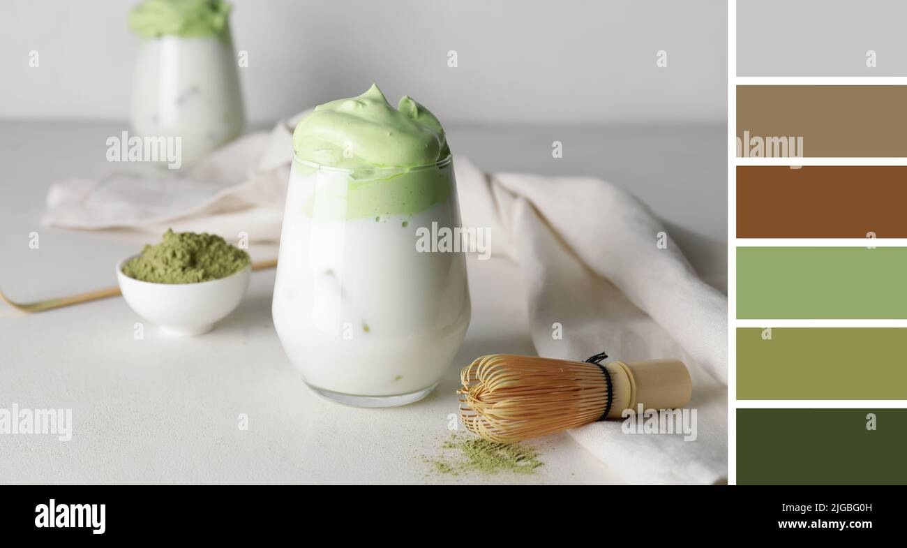 Glass of tasty dalgona matcha latte on light table. Different color ...