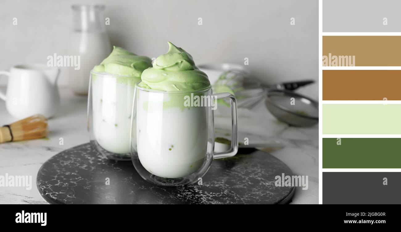Cups of tasty dalgona matcha latte on light table. Different color ...