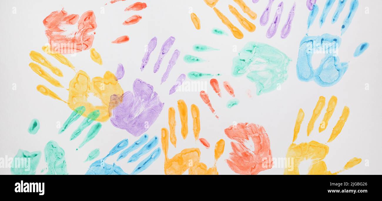Colorful human palm prints on white background Stock Photo - Alamy