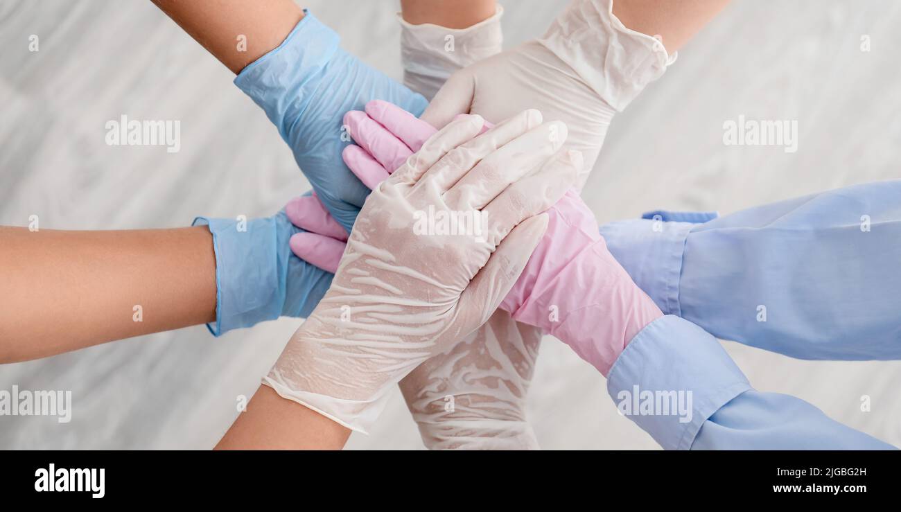 Team of doctors putting hands together, top view. Unity concept Stock ...