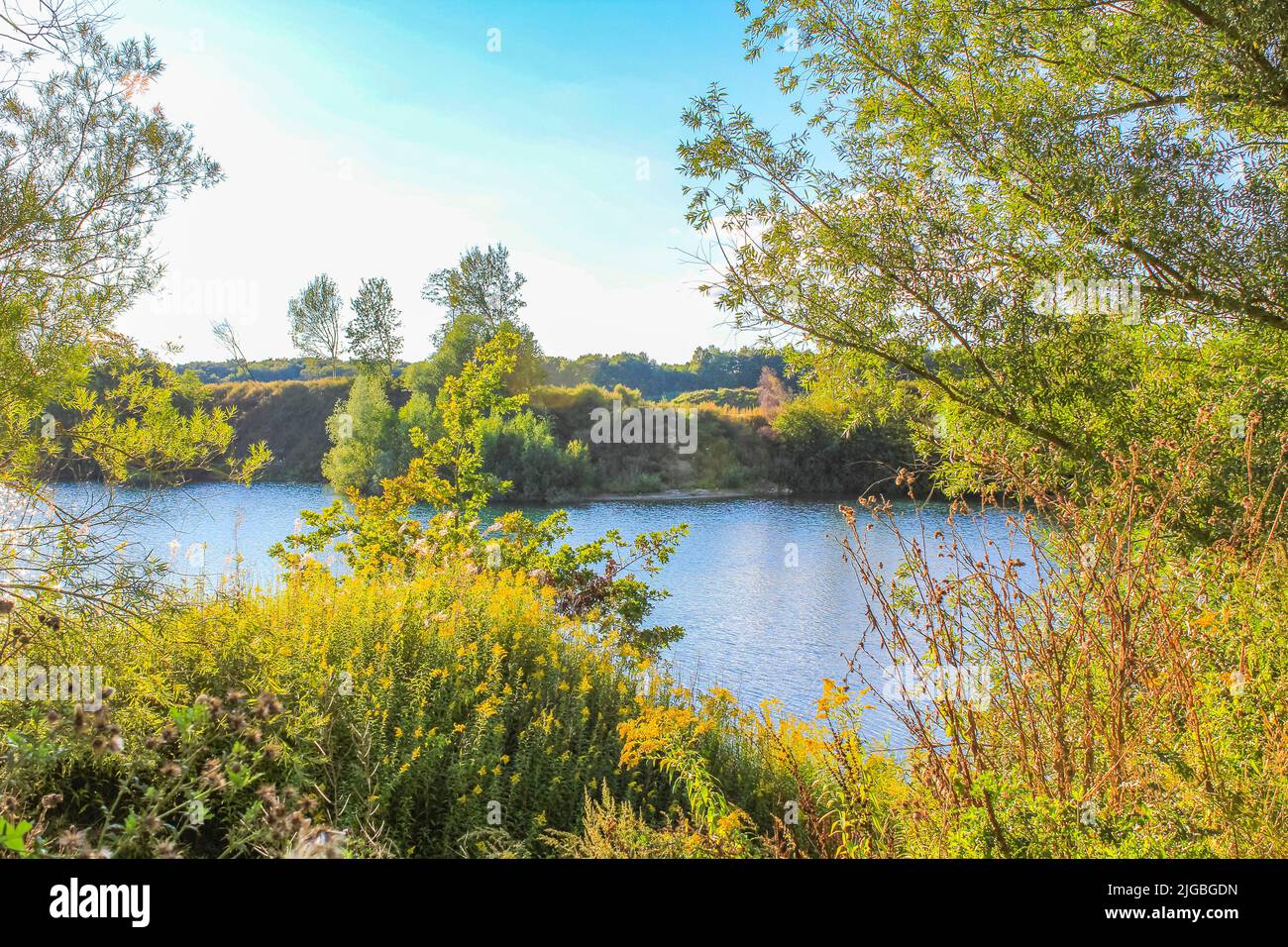 Beautiful quarry lake dredging pond lake with blue turquoise water blue ...