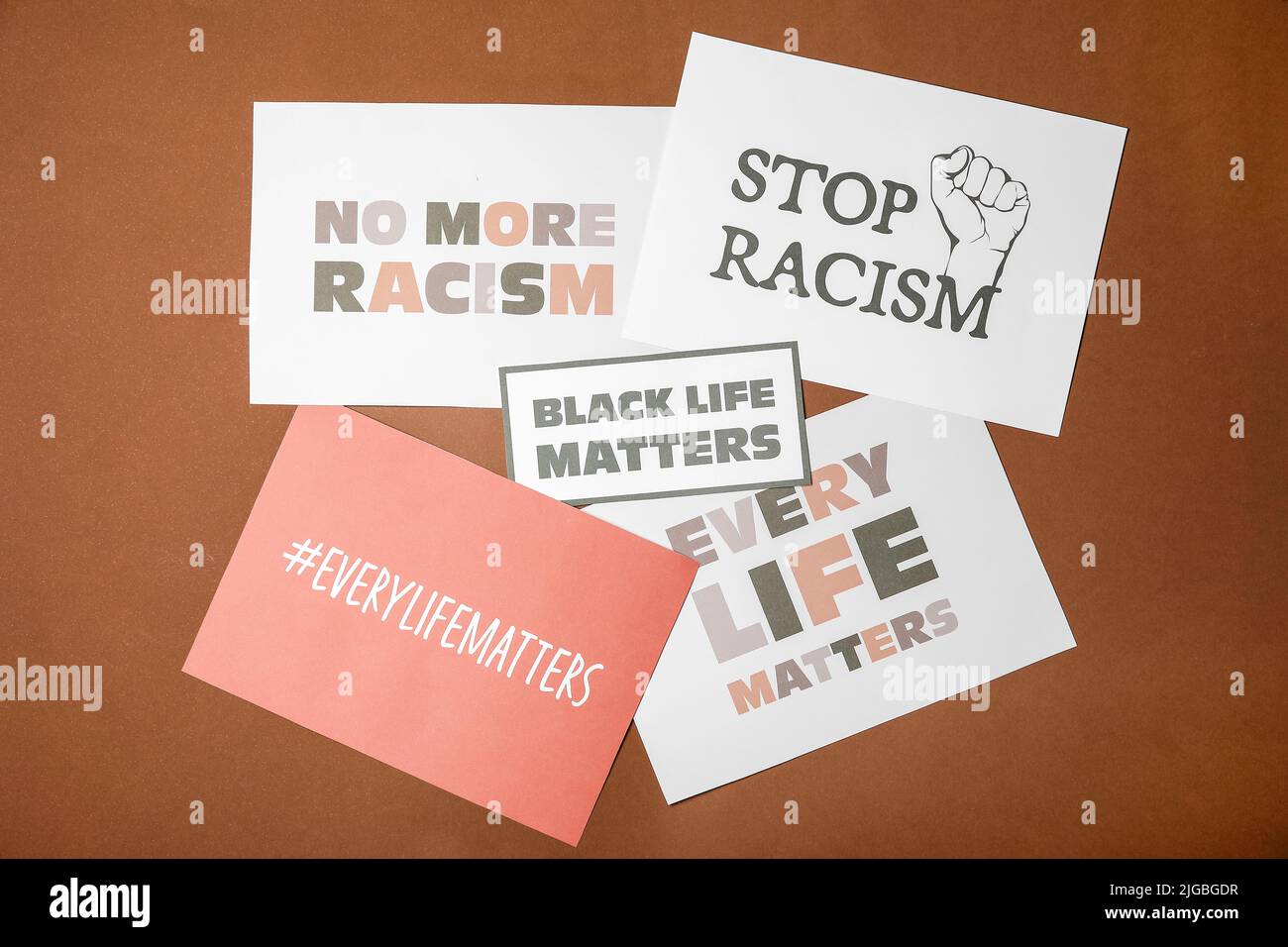 Different placards on color background. Concept of racism Stock Photo ...