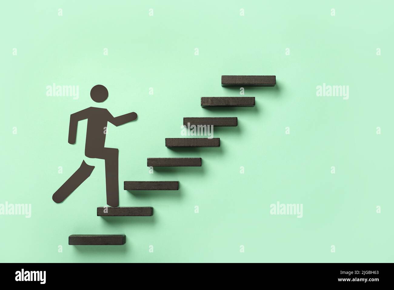 Ladder with running man on color background. Concept of progress Stock ...