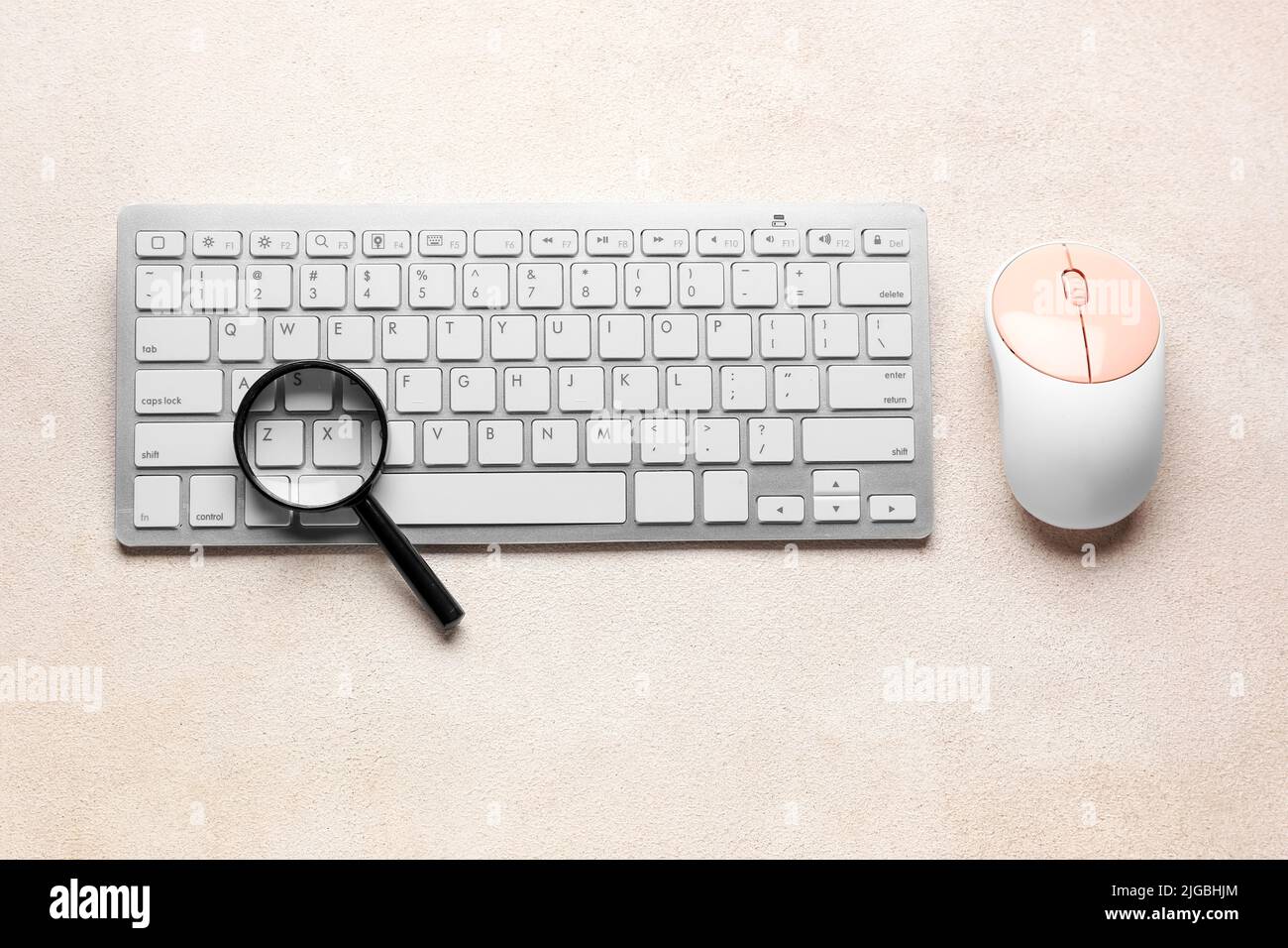 Keyboard, mouse and magnifier on light background. Concept of search ...