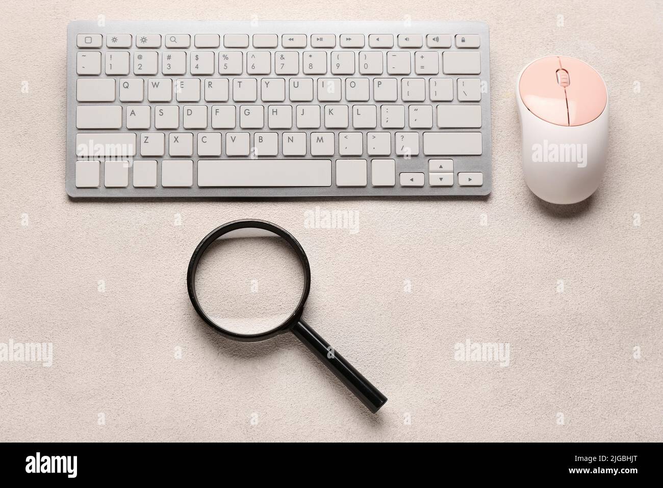 Keyboard, mouse and magnifier on light background. Concept of search ...