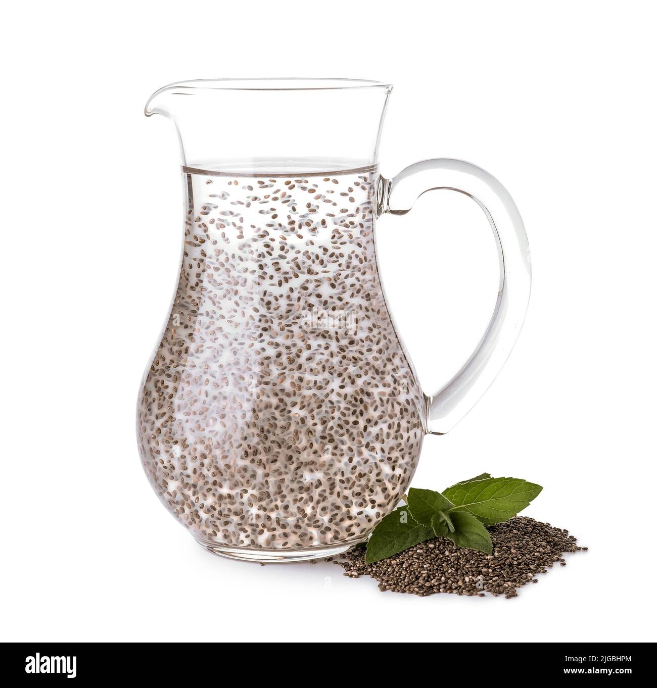 Glass pitcher of water with chia seeds on white background Stock Photo ...