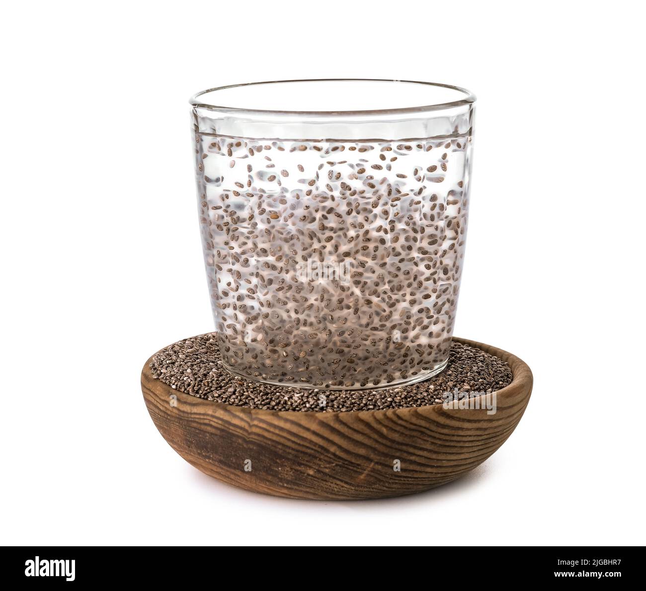 Glass of water and bowl with chia seeds isolated on white background ...