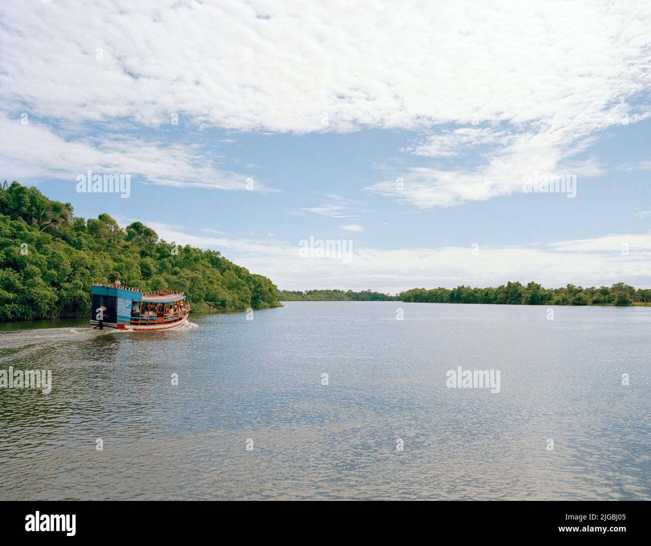A boat tour floats down the Rio Preguicas, Barreirinhas, Maranhao ...