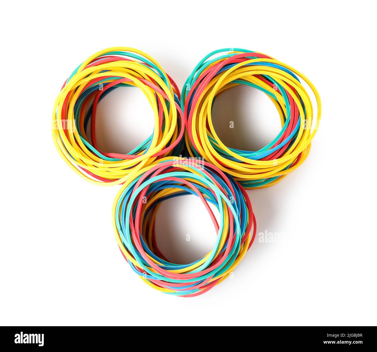 Three stacks of colorful rubber bands on white background Stock Photo ...