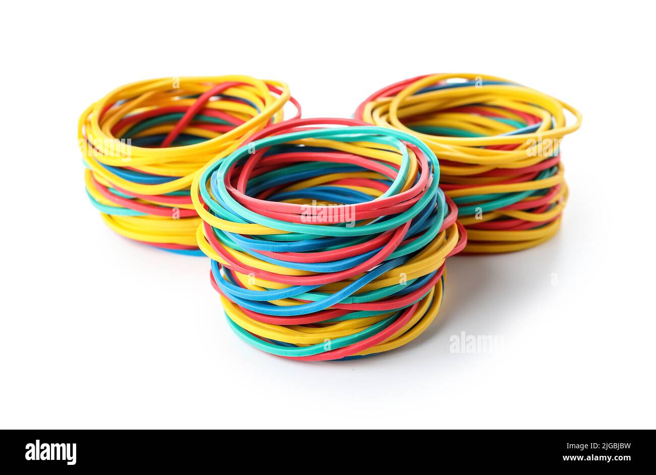 Three stacks of colorful rubber bands on white background Stock Photo ...