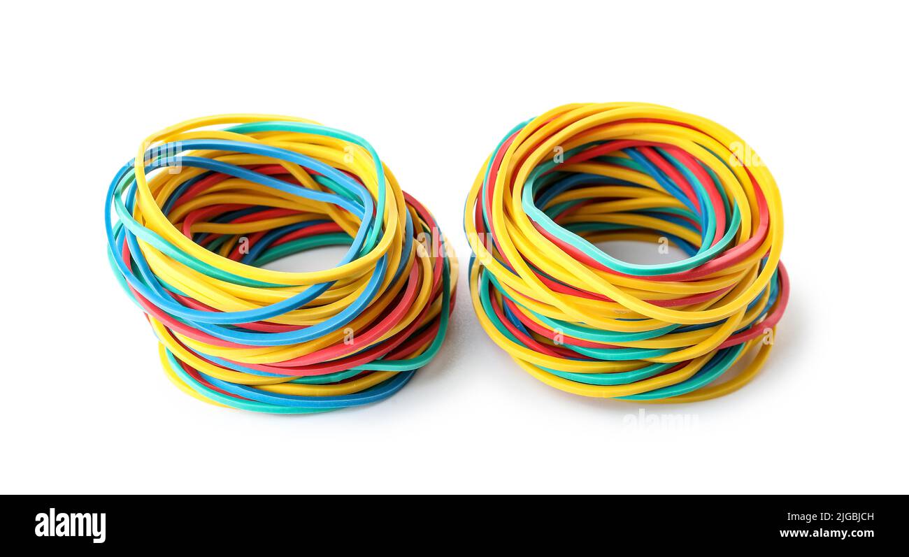 Two stacks of colorful rubber bands on white background Stock Photo - Alamy