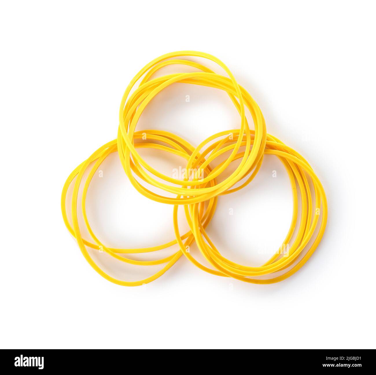 Yellow rubber bands on white background Stock Photo - Alamy