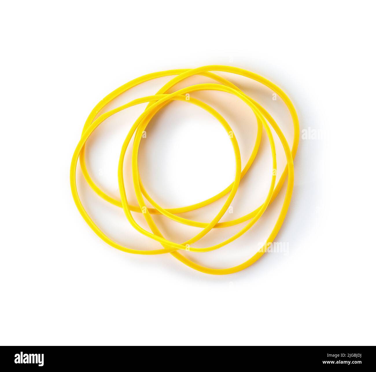 Yellow rubber bands on white background Stock Photo - Alamy