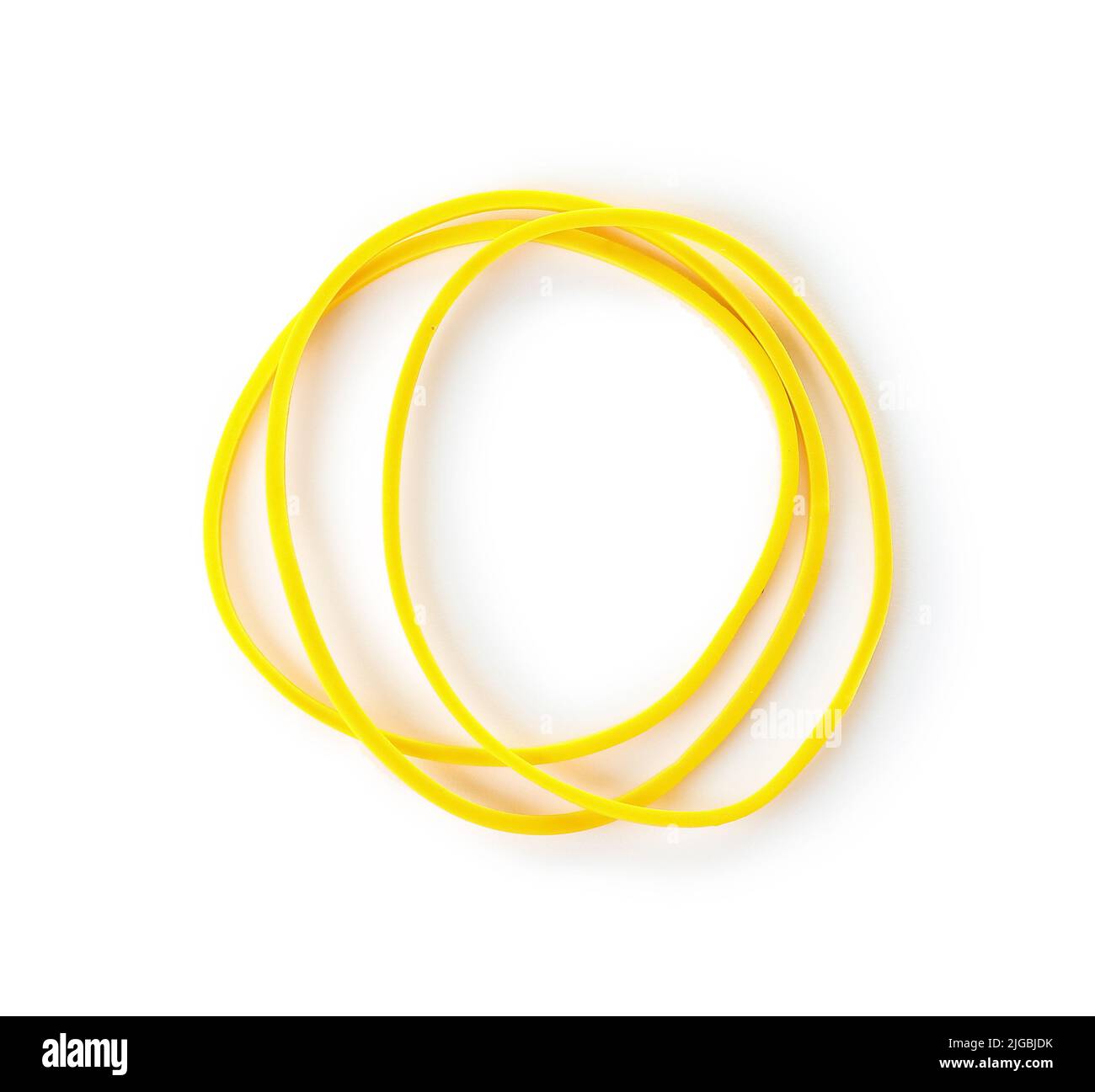 Yellow rubber bands on white background Stock Photo - Alamy