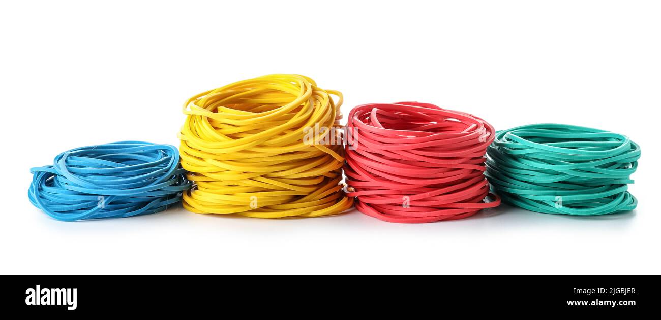 Stacks of different rubber bands on white background Stock Photo - Alamy