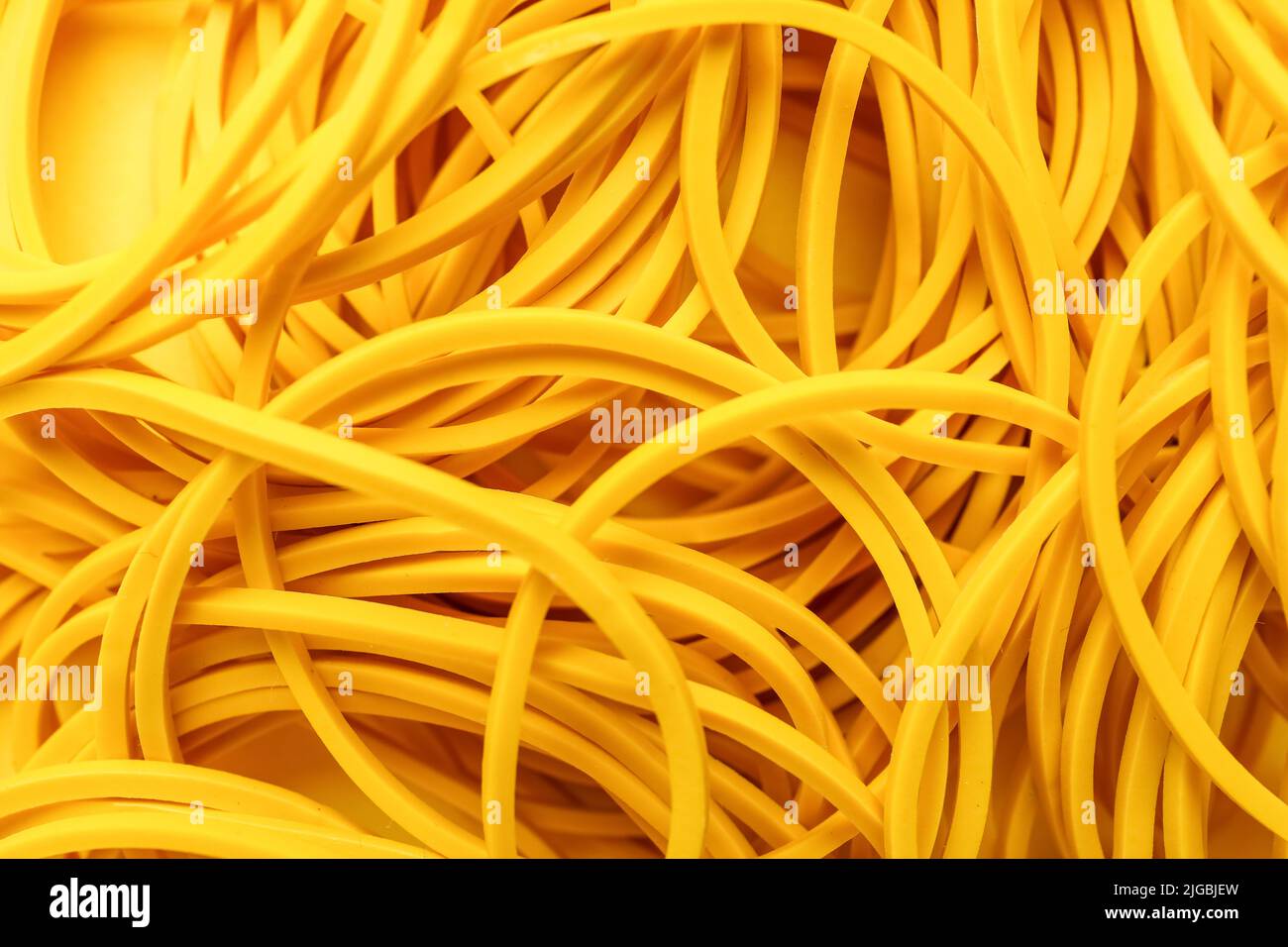 Yellow rubber bands hi-res stock photography and images - Alamy