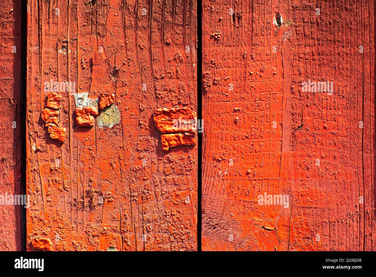 Red wooden wall. Mahogany texture. Bright paint. Poor wood painting ...