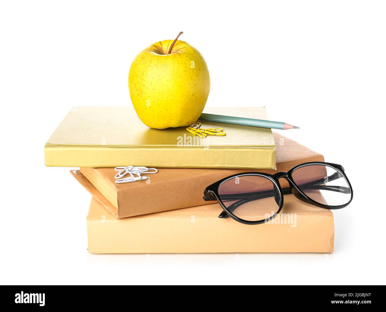 Books with apple, stationery and eyeglasses on white background Stock ...