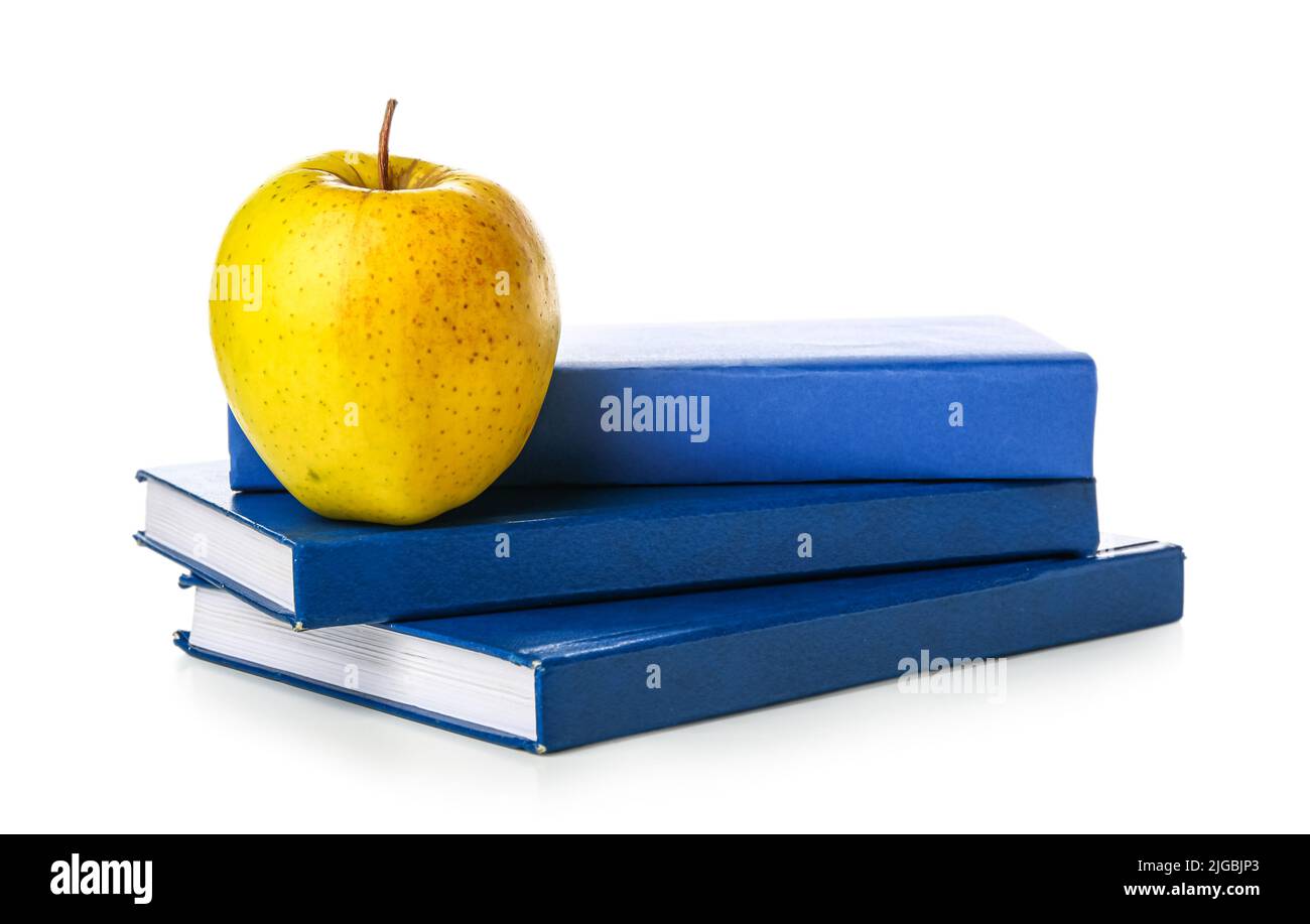 Books and apple on white background Stock Photo - Alamy