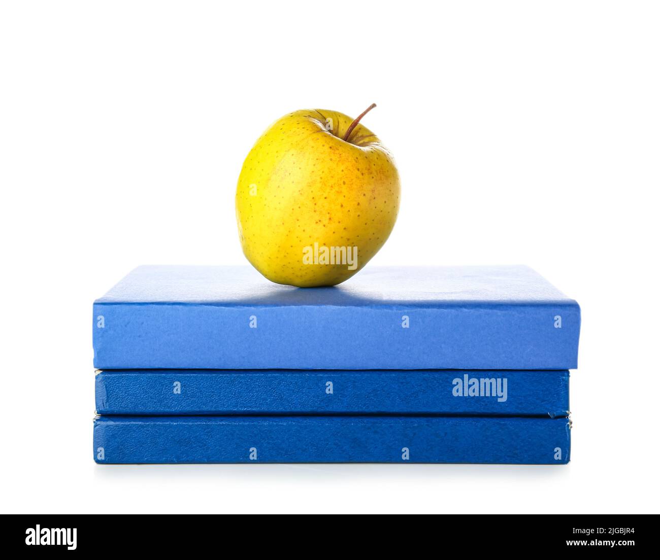Books and apple on white background Stock Photo - Alamy
