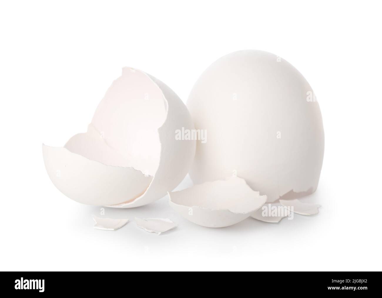 Broken egg shells on white background Stock Photo - Alamy