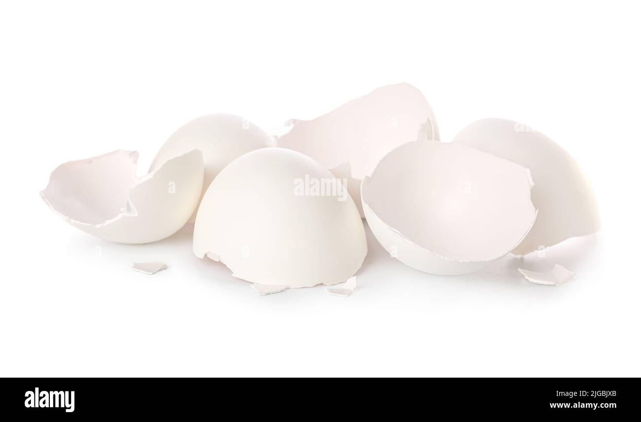 Heap of egg shells on white background Stock Photo - Alamy