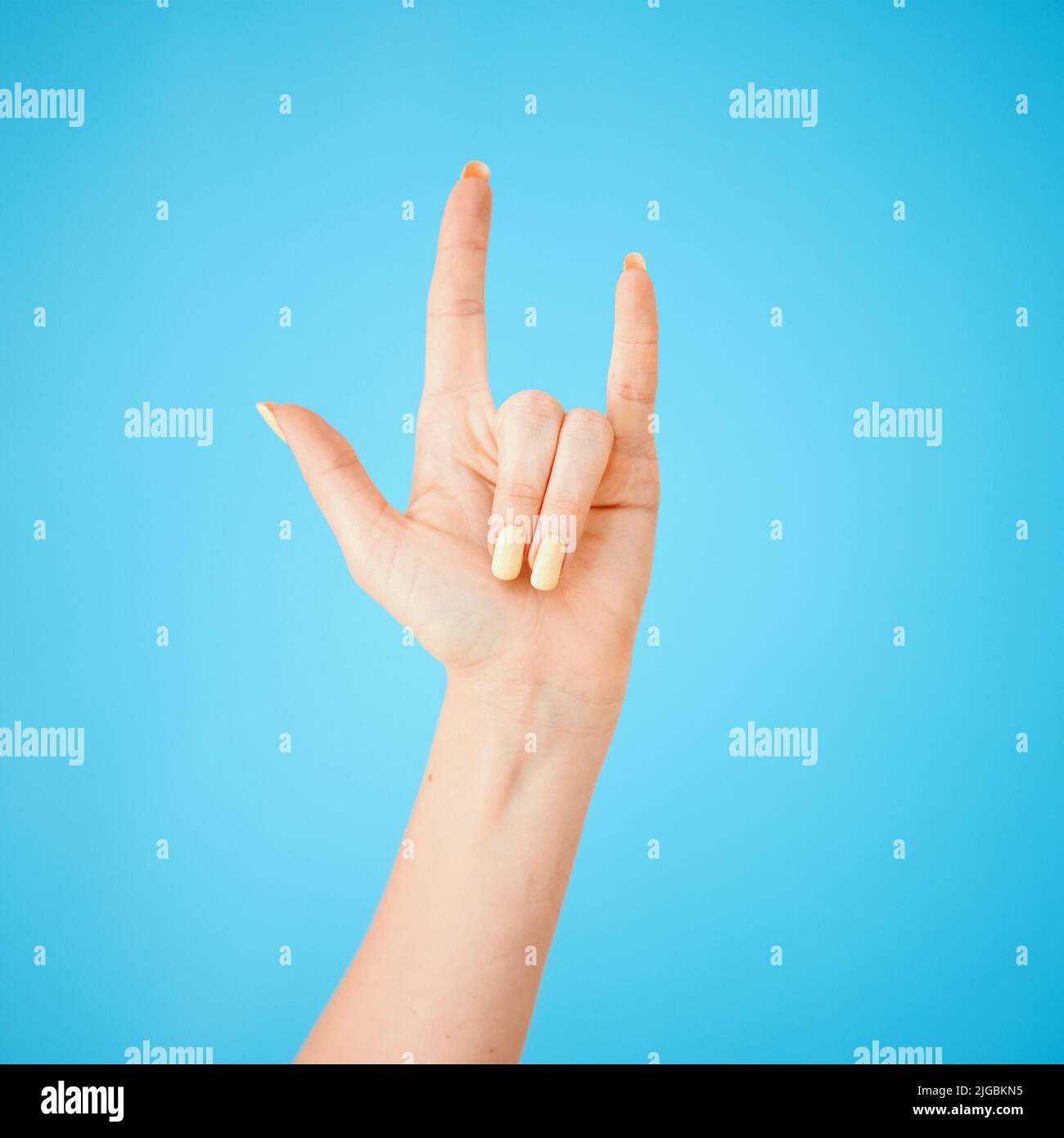 Party on my people. Studio shot of an unrecognisable woman making a ...
