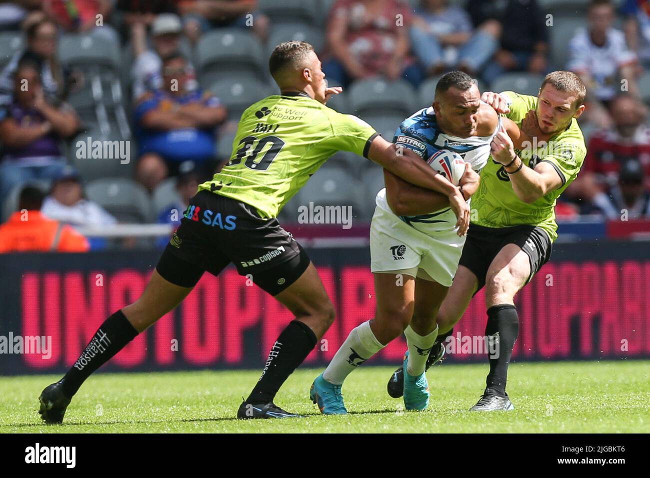 Latrell Schaumkel #2 of Toulouse Olympique is tackled by Corey Hall #30 ...