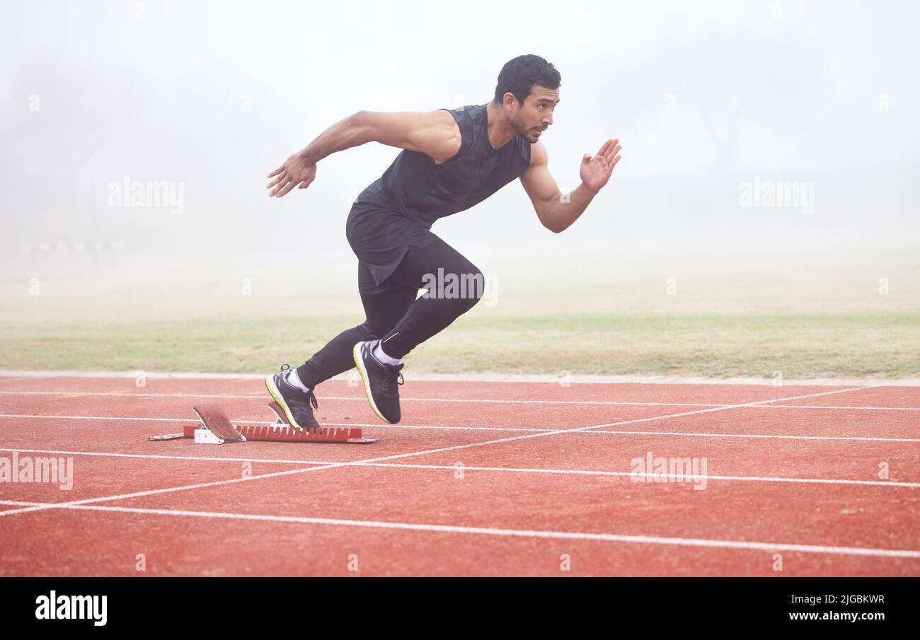 Male athlete on a running track hi-res stock photography and images - Alamy