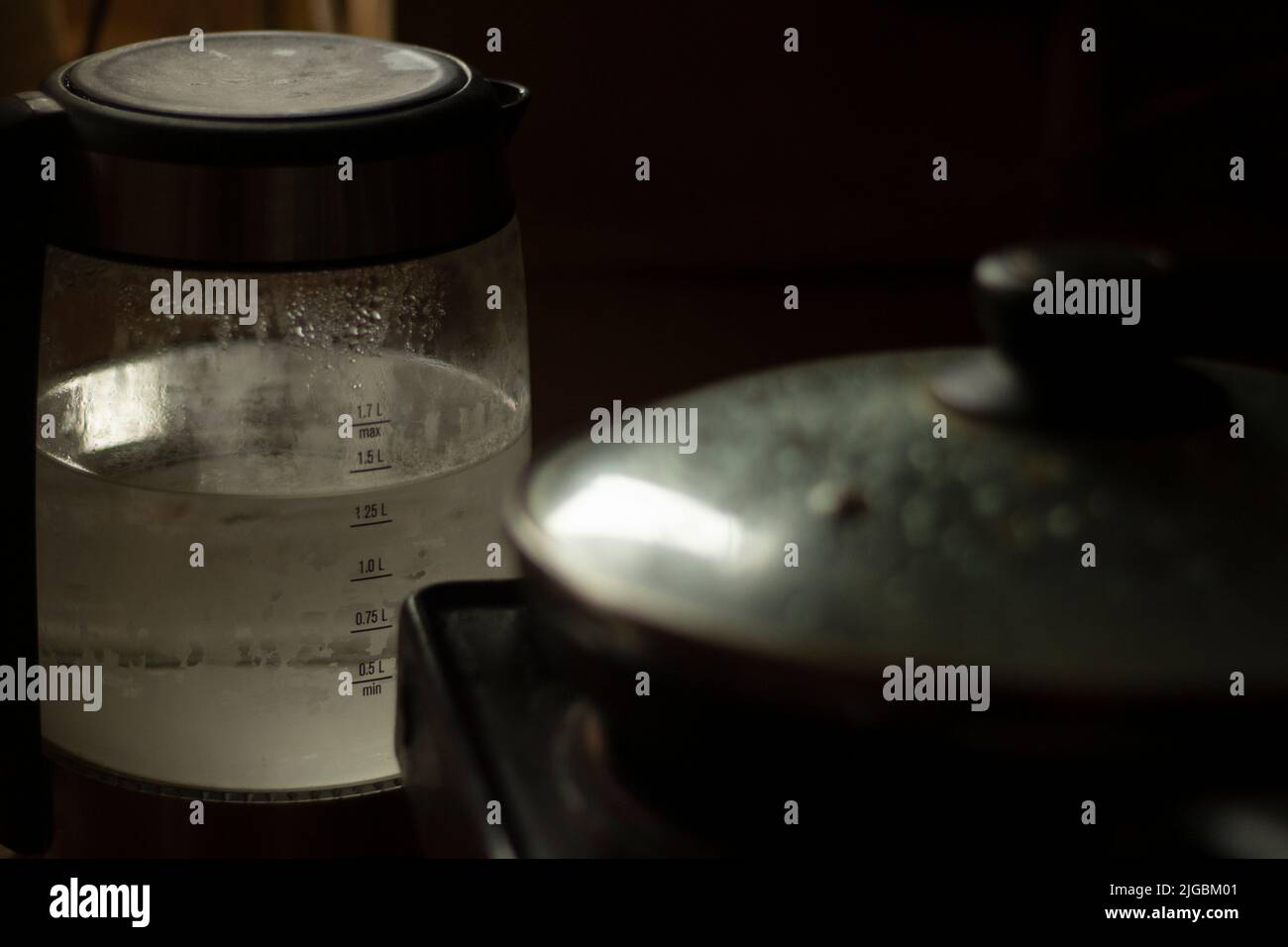 Frying pan with lid in kitchen. Frying pan with swollen glass. Interior ...