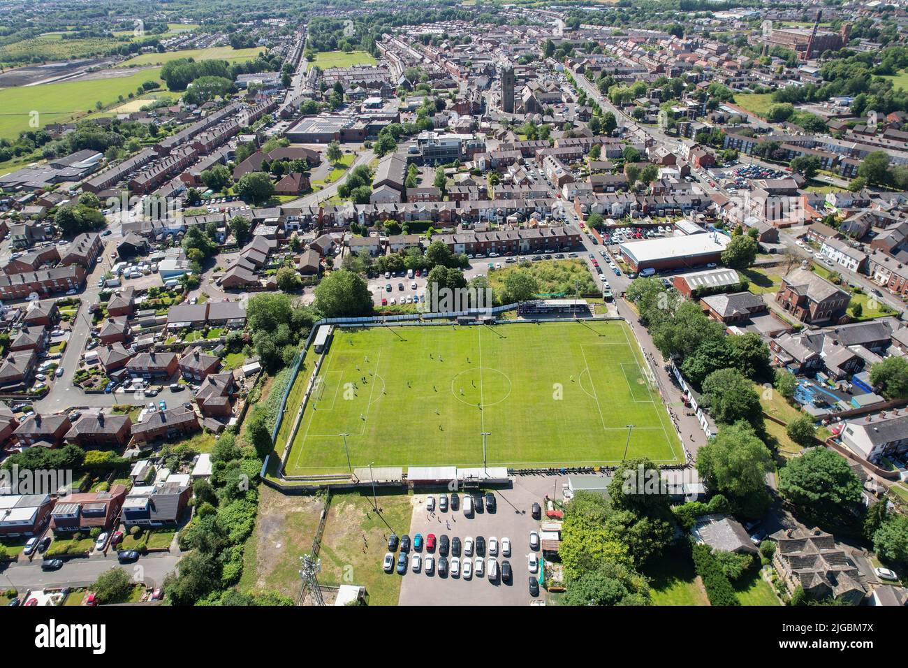 Aerial drone top view of football soccer field with people playing ...