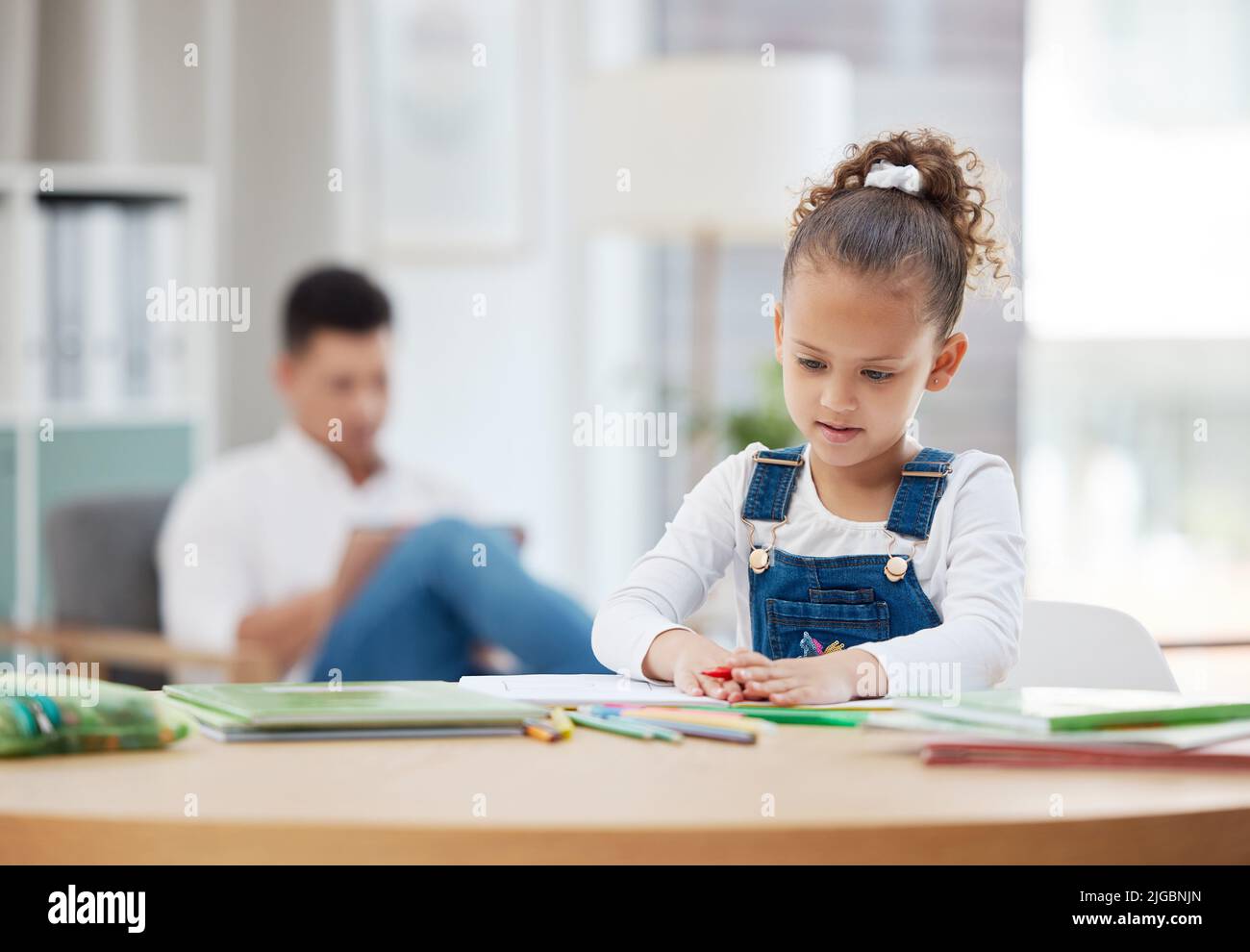 Time for homework. a little girl doing homework at home Stock Photo - Alamy