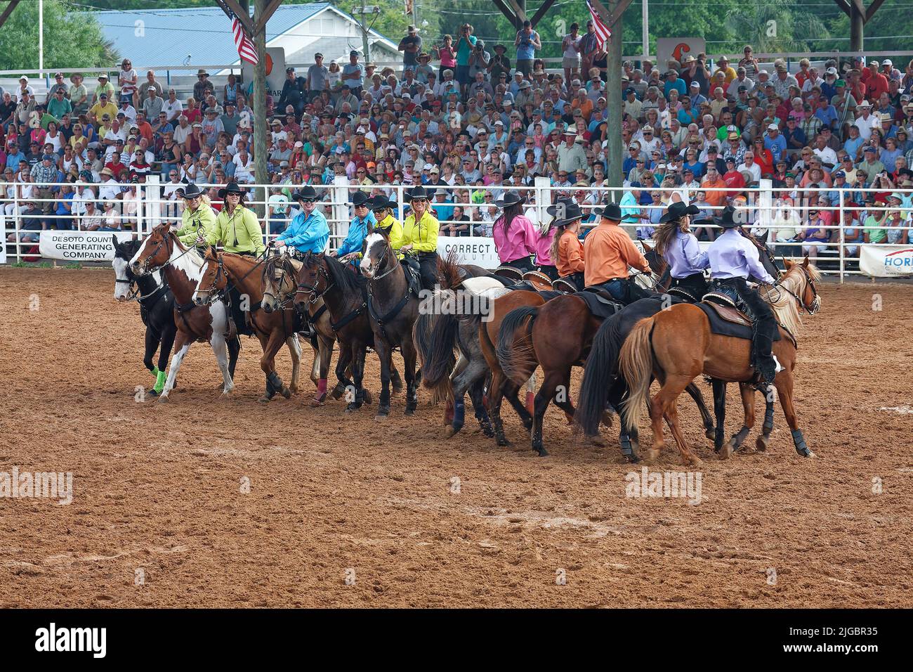 rodeo, entertainment, 12 people riding horses, line riding in circle ...
