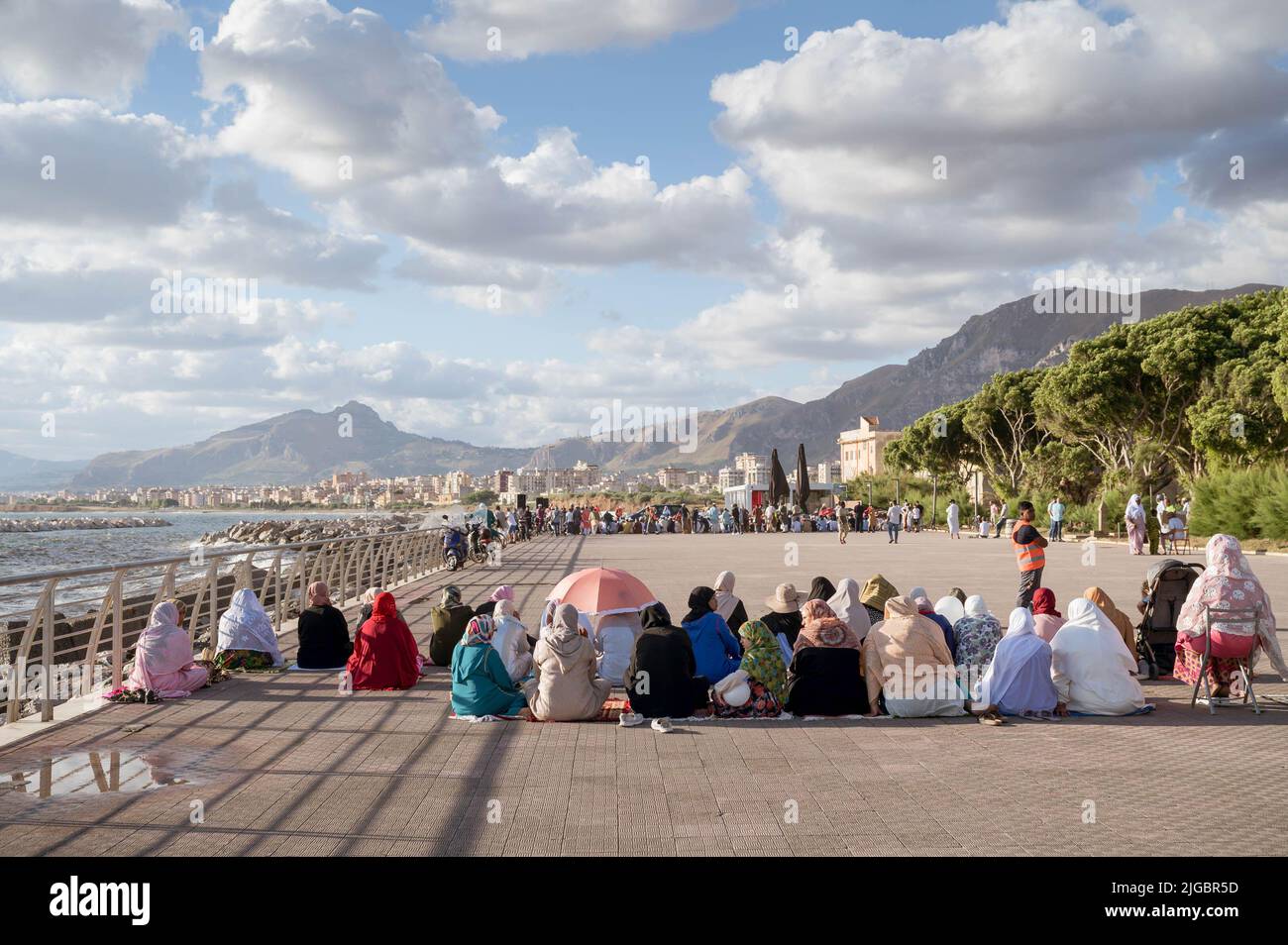 Muslim people seen gathering on the waterfront. The Muslim communities ...