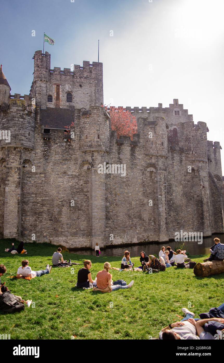 The people are lying and chilling by the park in front of Gravensteen ...