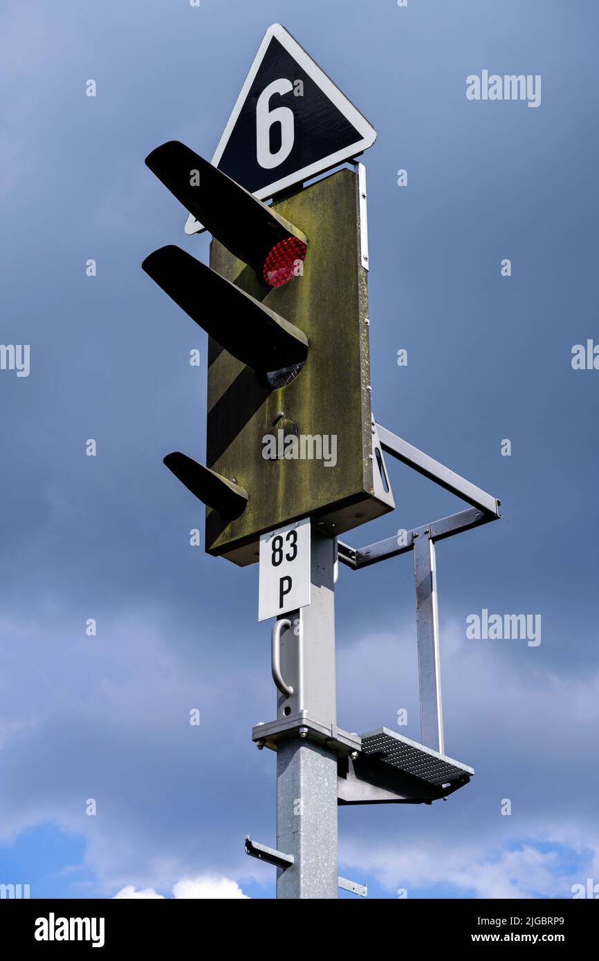 red railway signal at rail track Stock Photo - Alamy