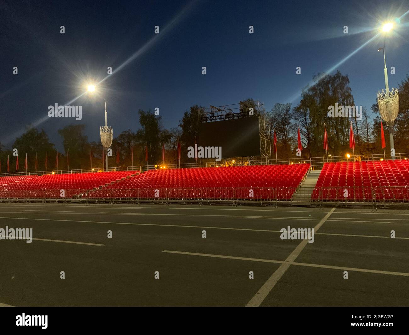 Bright red stadium seats at night Stock Photo - Alamy