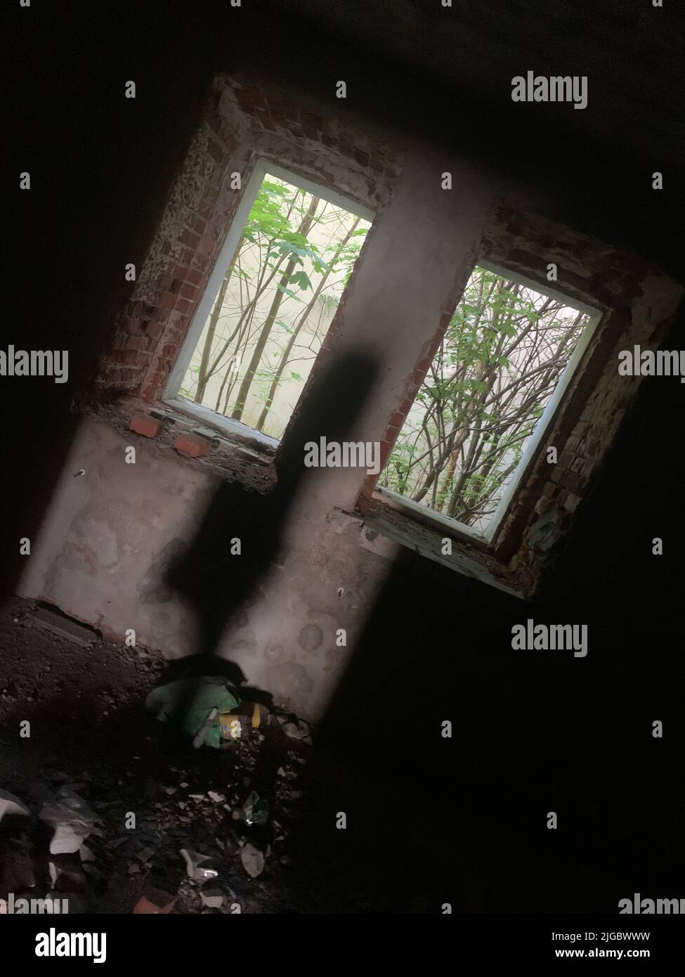 Dark room window of abandoned house with ghosts Stock Photo - Alamy