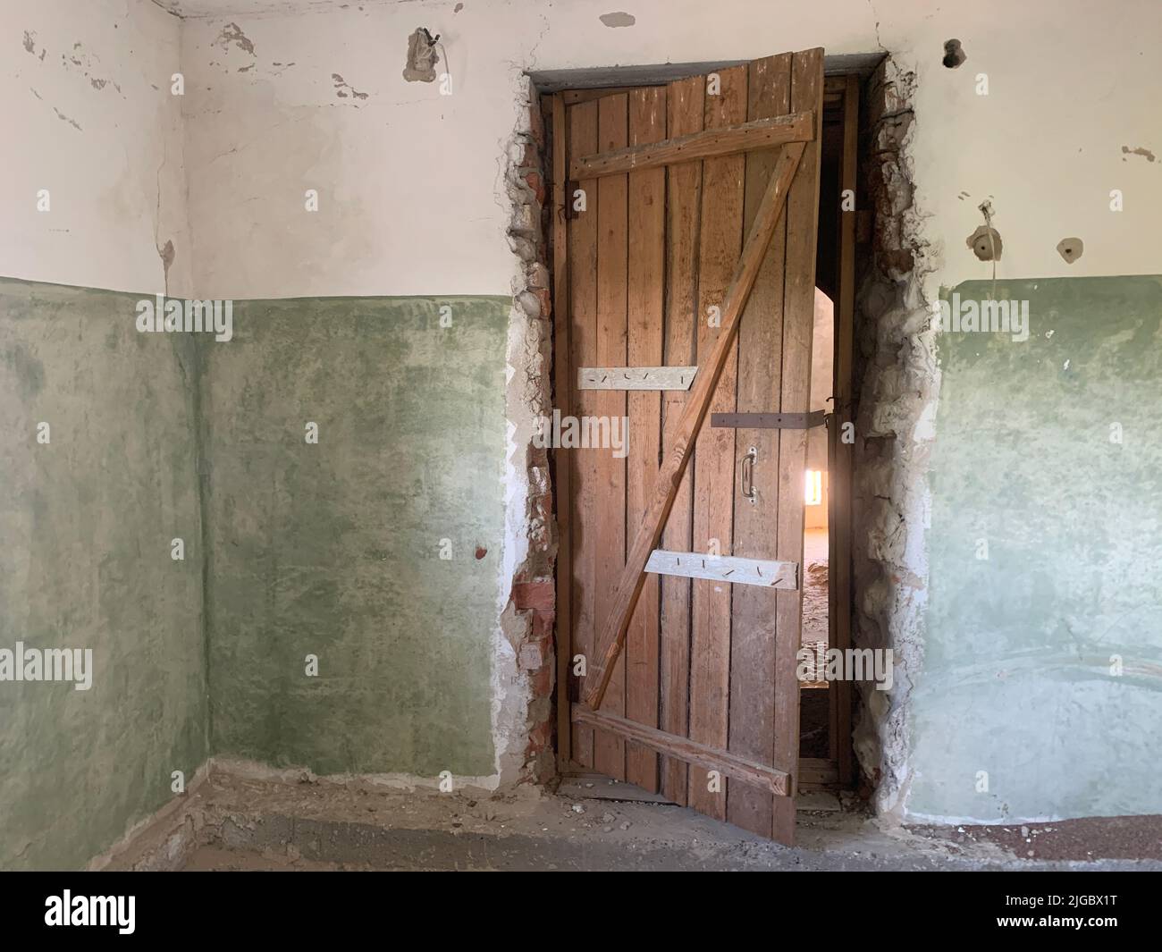 Half open door in abandoned house Stock Photo - Alamy