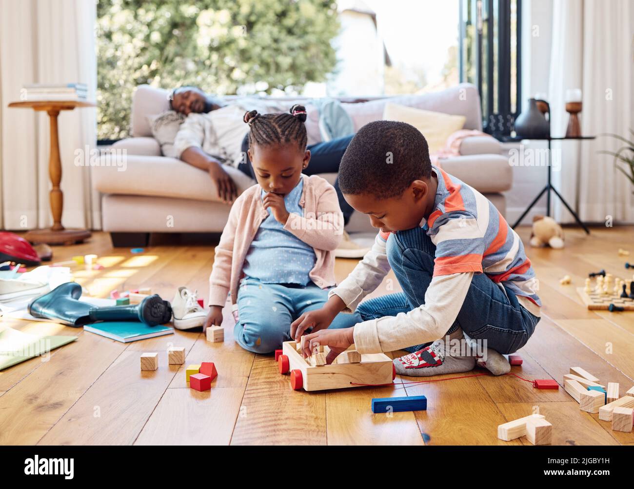 Theyve created quite a mess. two little siblings playing together at ...