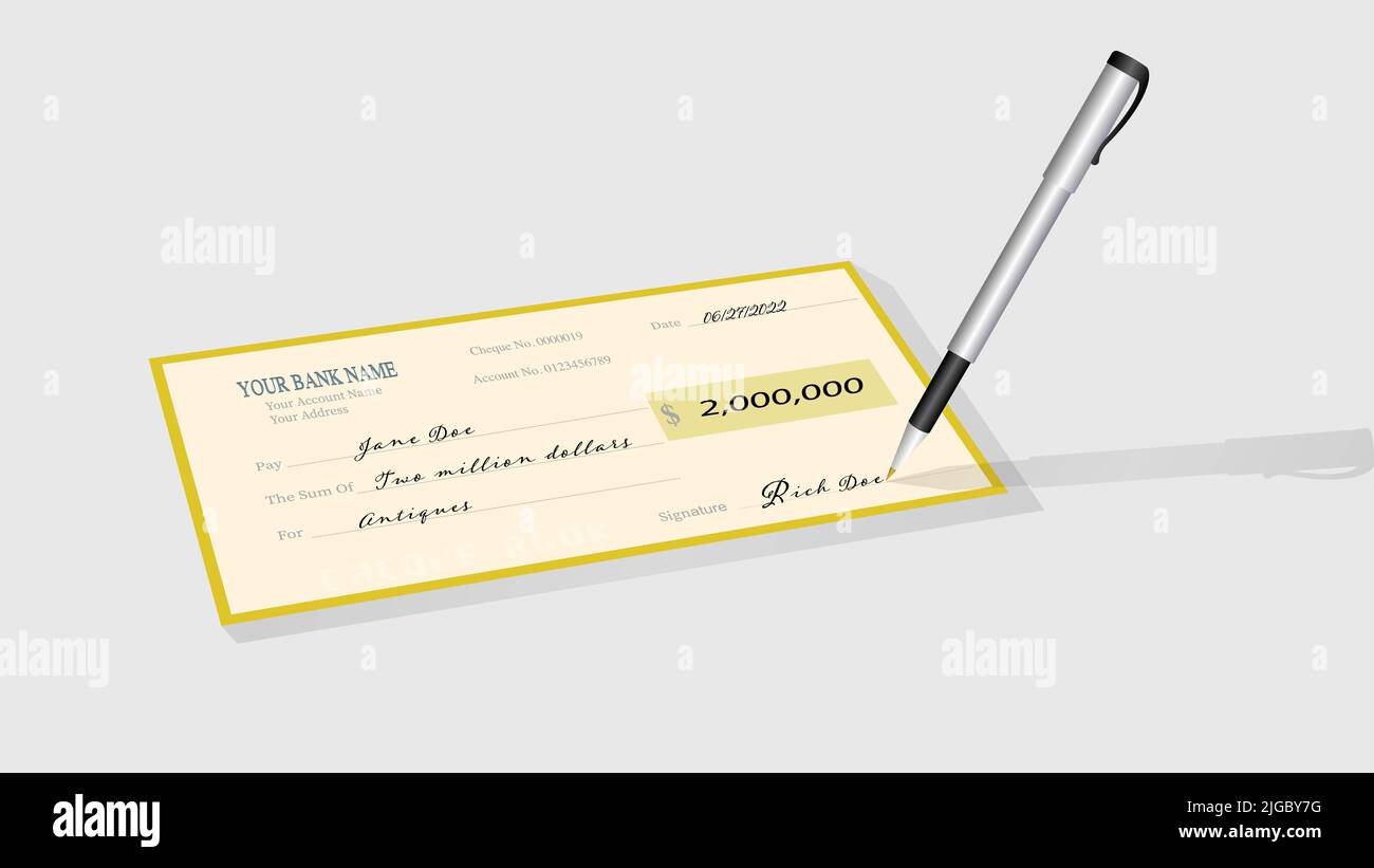 Cheque book in yellow color with black and silver pen in white ... Cheque book in yellow color with black and silver pen in white ...