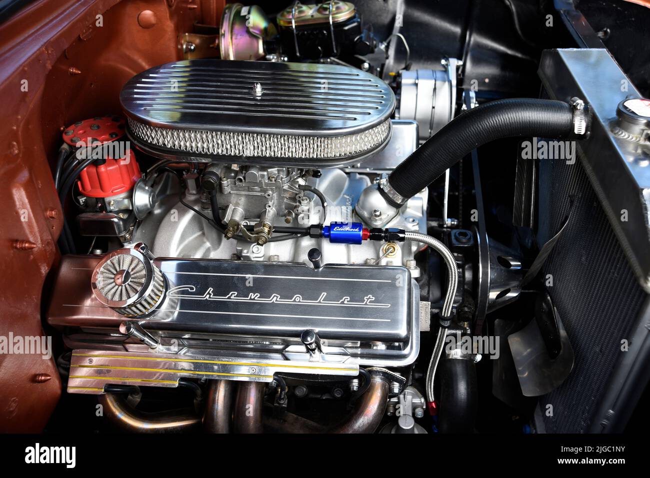 The engine of a 1956 Chevrolet Bel Air on display at a car show in ...