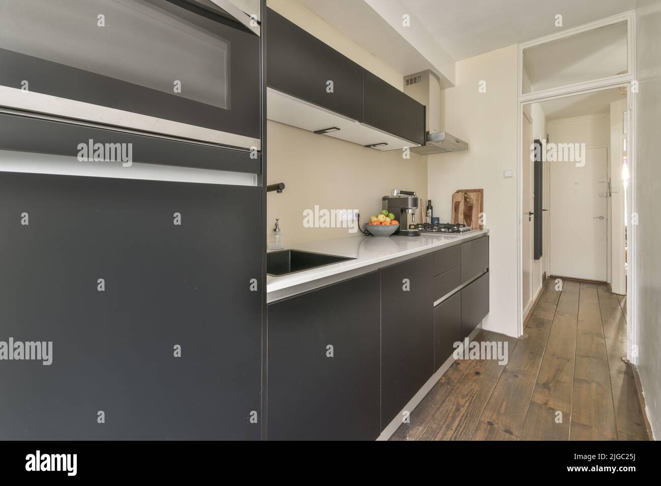 Design of mansard kitchen with wooden cabinets and minimalist interior ...