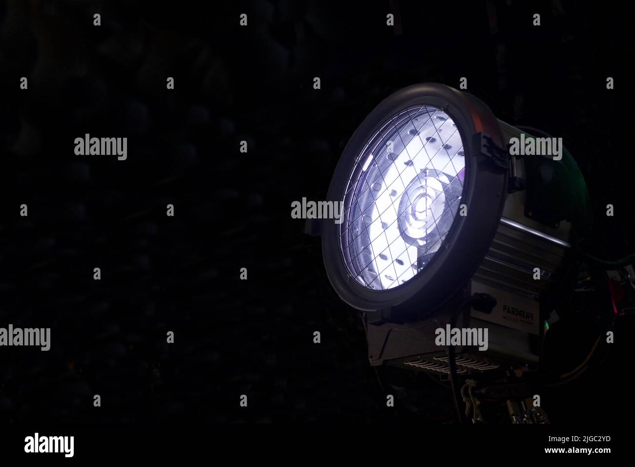 Movie light in the lower right corner of a black background with room ...