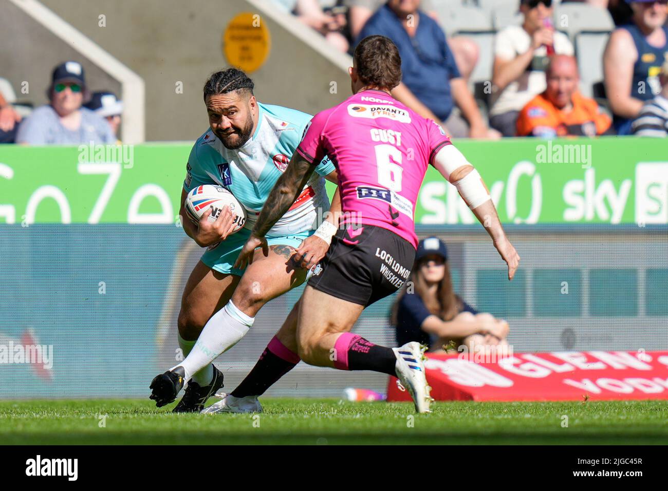 Konrad Hurrell #23 of St Helens cuts back on Cade Cust #6 of Wigan ...