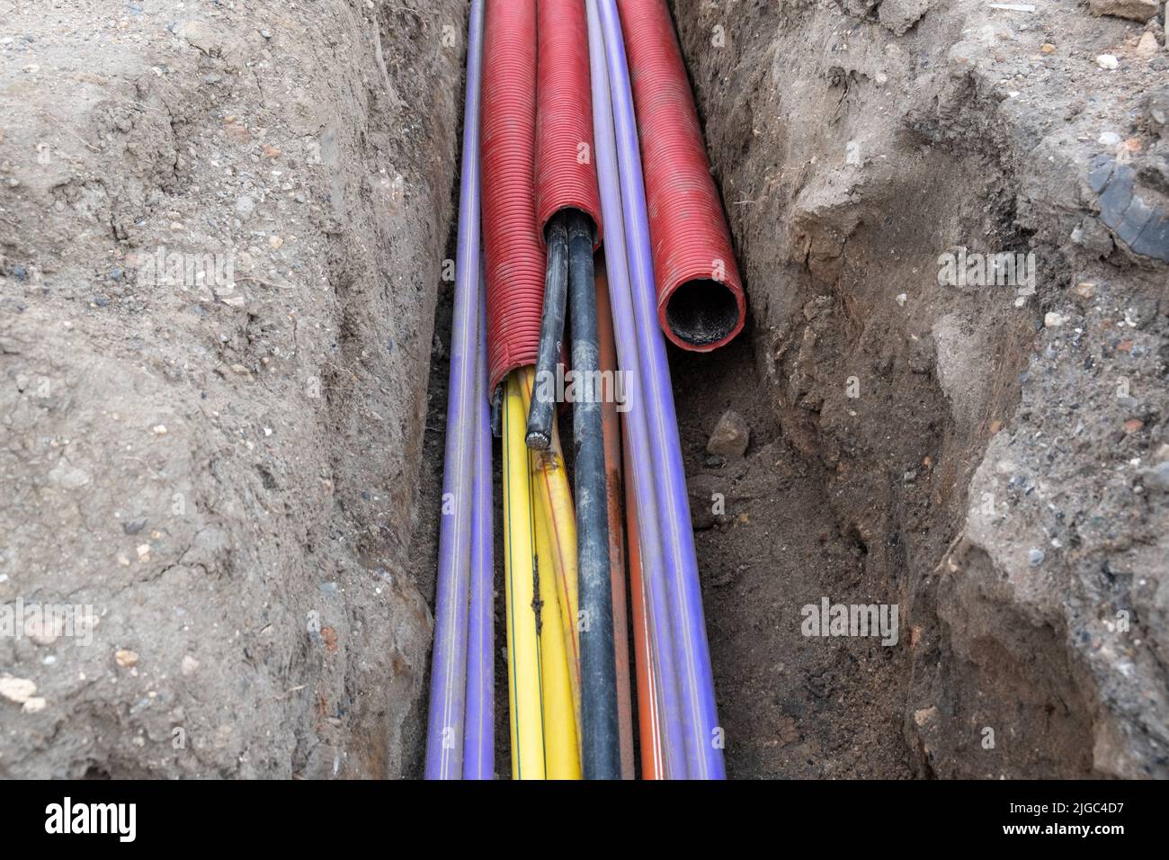 Electric cable underground. Broadband and power Lines in various colors ...