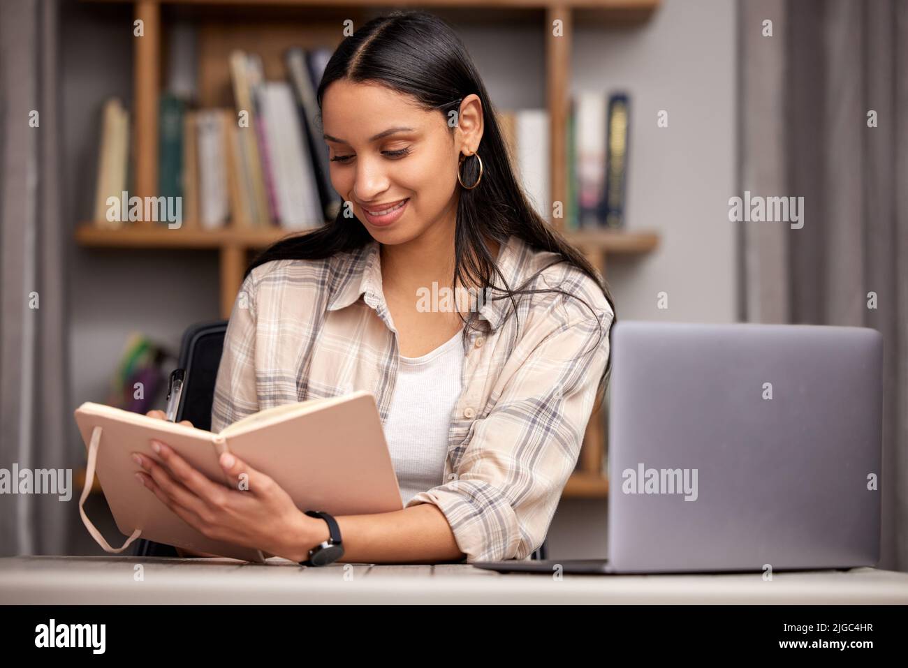 Finals are gonna be a breeze. an attractive young female student taking ...