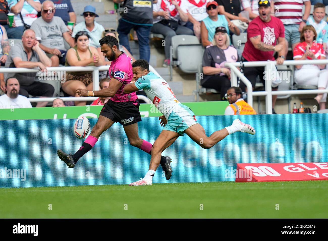 Bevan French #1 of Wigan Warriors kicks cross field for John Bateman ...