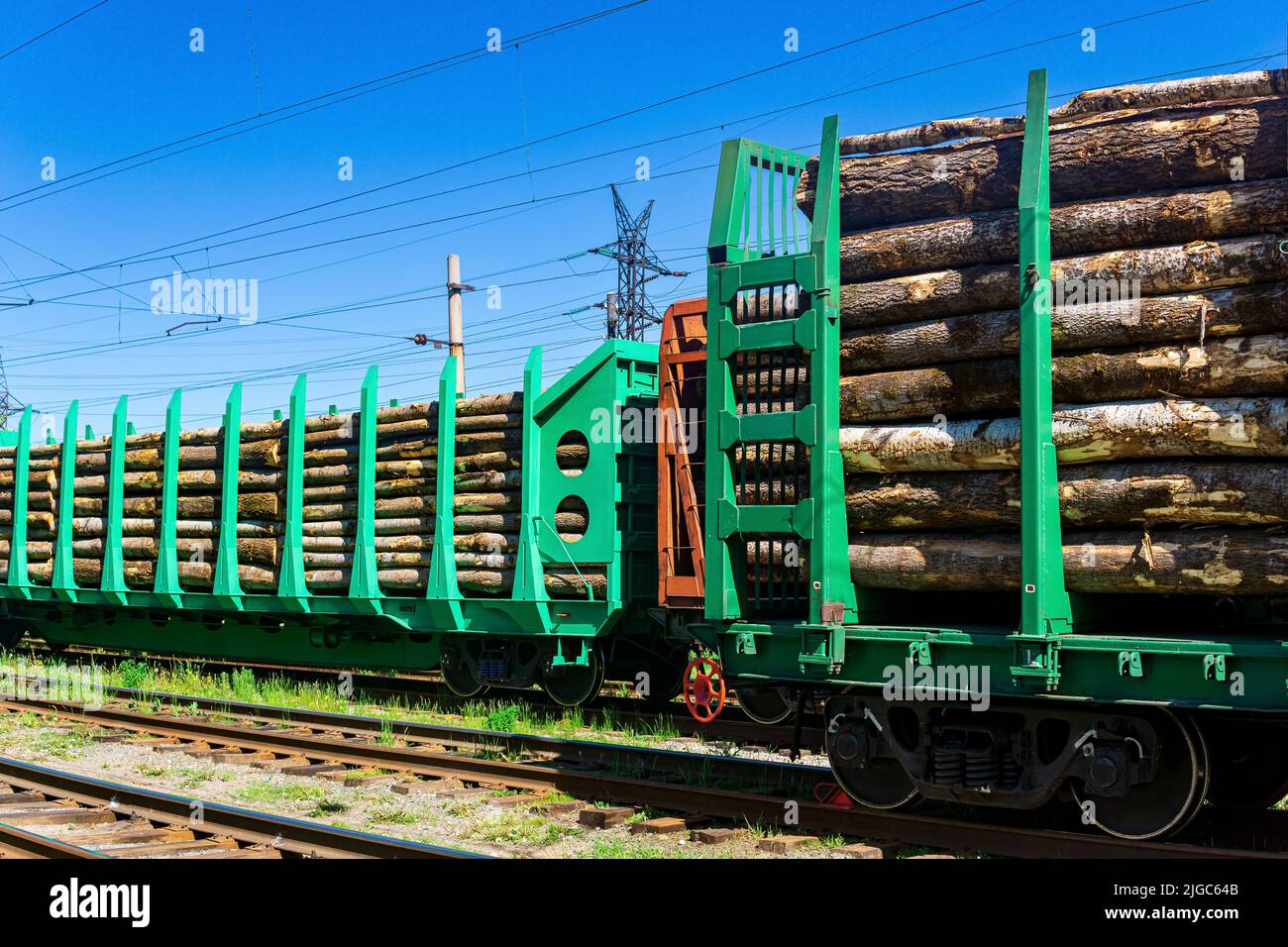 loaded railway wagons for carrying of logs close-up Stock Photo - Alamy